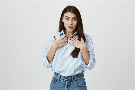 Indoor Portrait Of Attractive Cute Girl With Long Hair Expressing Surprise And Shock With Body