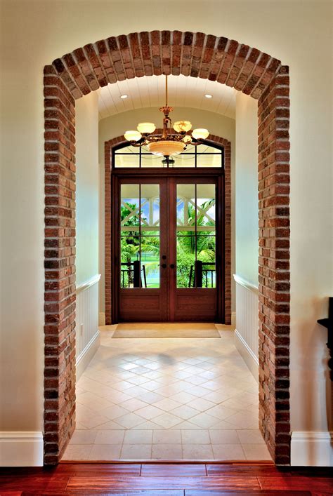 Brick Arch Entryway With Glass Doors