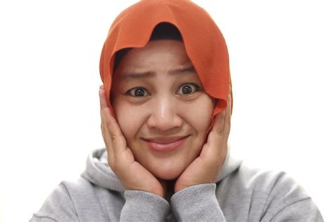 Premium Photo Shy Guilty Asian Muslim Woman Touching Her Cheek While
