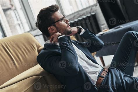 Paying Attention To Every Detail Handsome Young Man In Full Suit