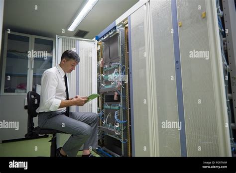 Network Engineer Working In Server Room Stock Photo Alamy