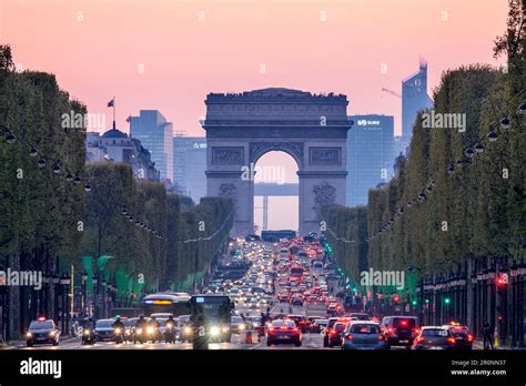 Evening Champs Elysees With Arc De Triomphe And La Defense In The