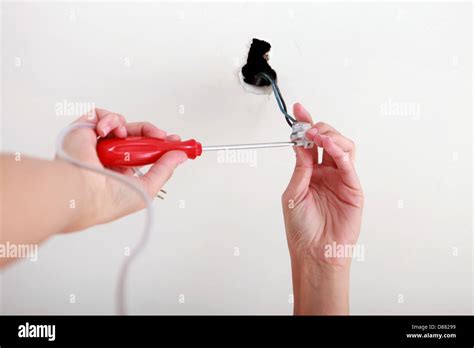 Man Fixing Ceiling Lighting Stock Photo Alamy