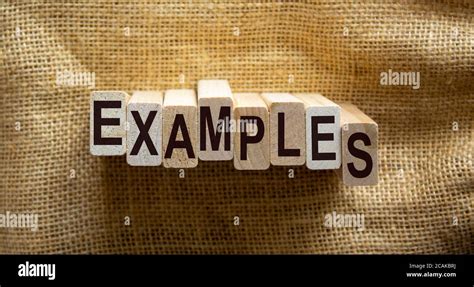 Concept Word Examples On Wooden Blocks On A Beautiful Canvas Background Business Concept