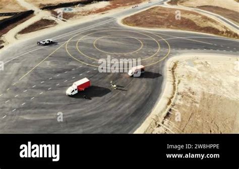 Aerial View Of Completion Of Road Construction Of Testing Ground For Cars Black Asphalt With