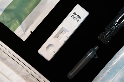 Premium Photo Flat Lay Picture Of A Negative Antigen Test On Black