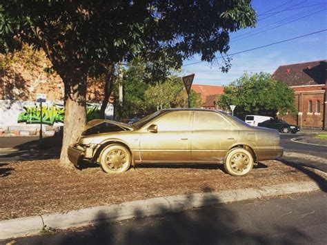 Crashed Car Randomly Gets A Golden Makeover 4 Pics
