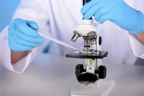 Premium Photo Man Using Microscope In A Lab