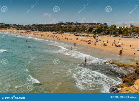 Vacationers In Arrabassada Beach One Of The Famous Golden Sand Beaches
