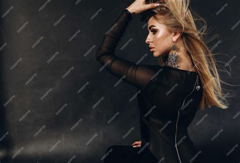 Premium Photo Blonde Girl In Black Dress Posing