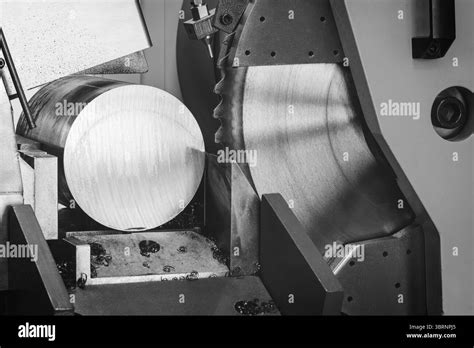 Automatic Circular Saw Cutting Large Metal Part With Round Cross