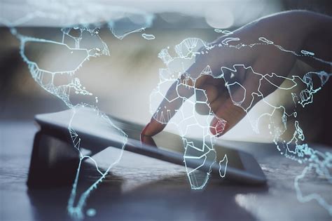 Premium Photo Close Up Of Hand Using Tablet With Creative Glowing Map On Blurry Background