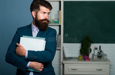 Portrait Of Confident Caucasian Male Teacher In Classroom Man Tutor Or