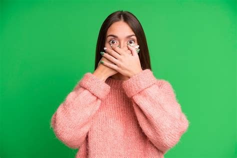Premium Photo Covering Mouth With Hands With A Shocked Surprised