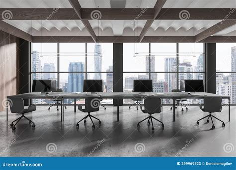 Grey Coworking Interior With Seats Pc Computers And Desk In Row Near