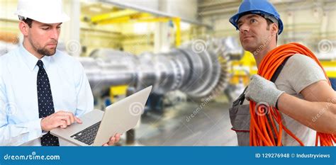 Workers Assembling And Constructing Gas Turbines In A Modern Ind Stock
