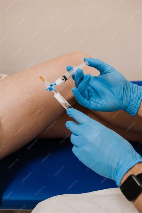 premium photo vascular surgeon injects chemical solution into woman