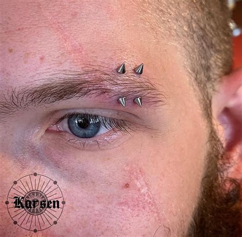 Eyebrow And Bridge Piercings — Solis Invictus Body Piercing — Rites Of Passage Tattoo