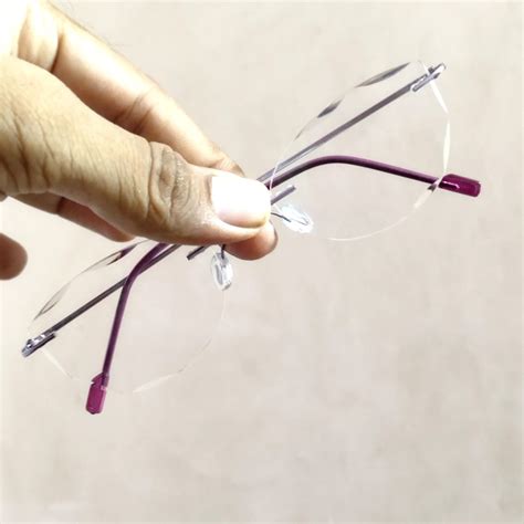 Purple Cat Eye Rimless Glasses With Diamond Cut Edges Glasses India