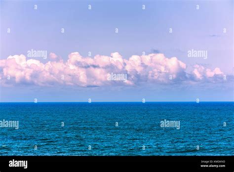 A Simplistic View Of The Pacific Ocean And The Sky With Clouds Stock