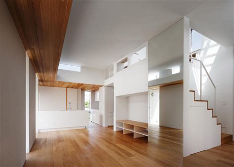 Mirrors And White Walls Draw Light Through House In Okazaki