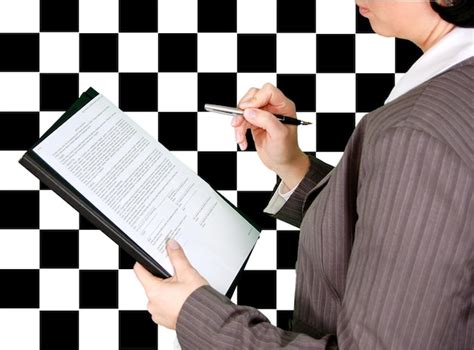 Premium Psd A Man Is Holding A Pen And A Document That Says A Document