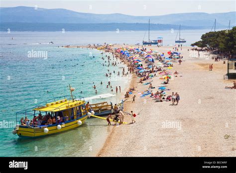 Zlatni Rat Beach With A Tourists Boat Bol Brac Island Dalmatia