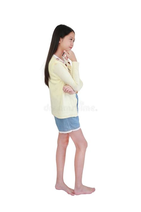 Portrait Of Young Asian Girl Standing Barefoot With One Hand Resting On
