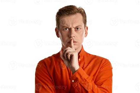 Close Up Portrait Of A Ginger Guy In Orange Shirt Posing Isolated On