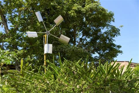 Windmill In A Rural Tropical Setting Renewable Energy Generation Stock