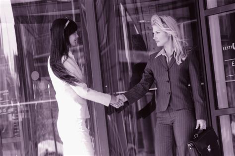 Two Businesswomen Shaking Hands Free Photo Download Freeimages