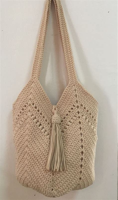 Crocheted Bag With Tasselled Handle And Fringe