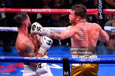 Canelo Alvarez Punches Caleb Plant During Their Championship Bout For