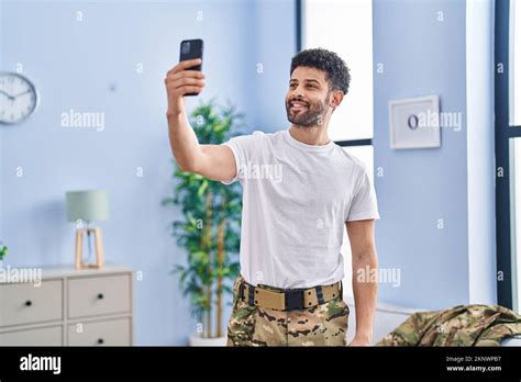 Young Arab Man Army Soldier Making Selfie By The Smartphone At Home