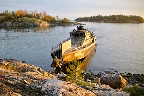 A German Soldier Is Boarding A Jehu Class Landing Craft Of The Finnish