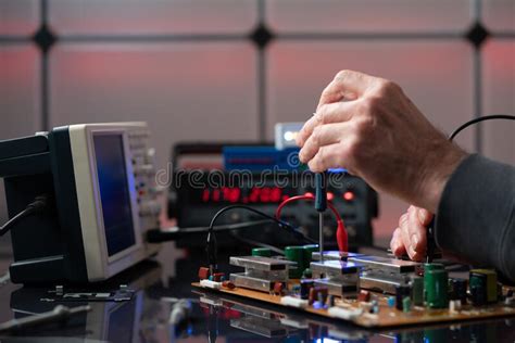 Debugging Electronics Device Pcb Witch Microcontroller In Electronics Laboratory Stock Image