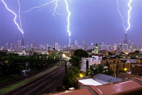 Three Bolts Of Lightning Simultaneously Strike The Chicago Skyline During A Wild Summer Storm