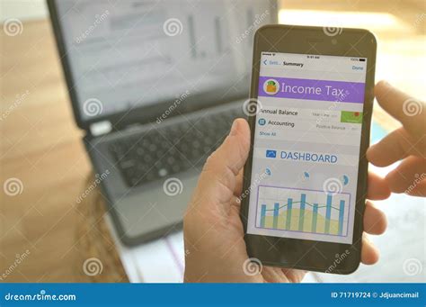 A Man Using A Mobile App To Calculate His Income Tax Stock Photo Image Of Form Home