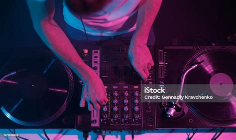 Overhead Photo Of Disc Jockey Mixing Records On Party In Night Club