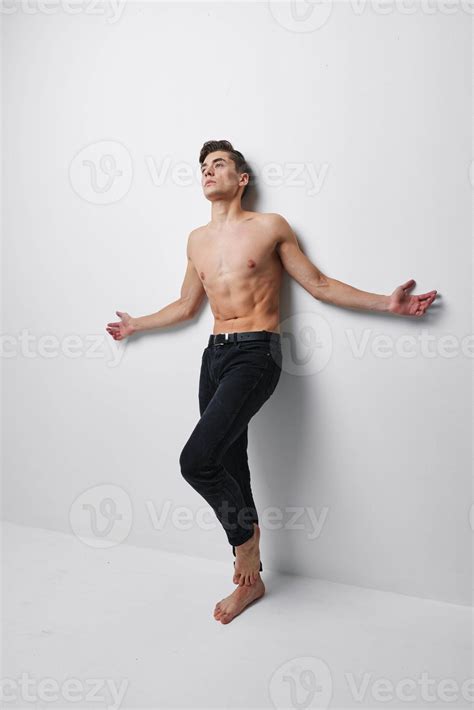 Young Man In Jeans Nude Torso Light Background Gesticulate With Hands