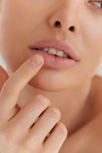 Premium Photo Lips Skin Care Sensual Woman Holding Finger On Her Sexy Lips