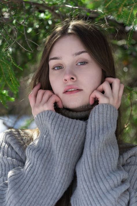 Close Up Portrait Of Caucasian Teenage Girl Looking At Camera Raised
