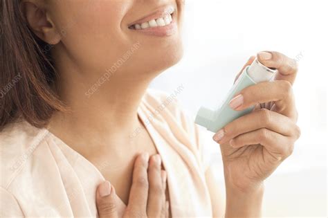 Woman Using Inhaler Stock Image F Science Photo Library