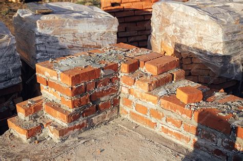 Premium Photo Bricks Masonry With Cement On Concrete Foundation