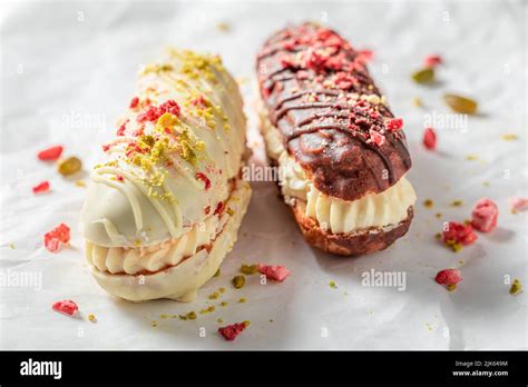 Delicious And Homemade Eclairs With Strawberries And Pistachios Chocolate Eclairs As A Small