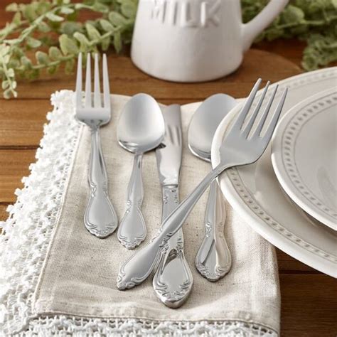 Riverridge 46 Piece Monogrammed Rose Pattern Flatware On Sale Bed