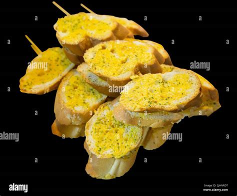 Die Cut Of Sliced Garlic Bread Skewers On Black Isolatedblack
