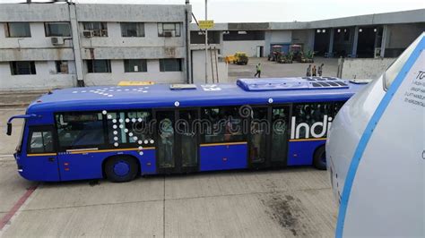 A Fully Packed Passenger Bus Standing At The Airport Runway Editorial