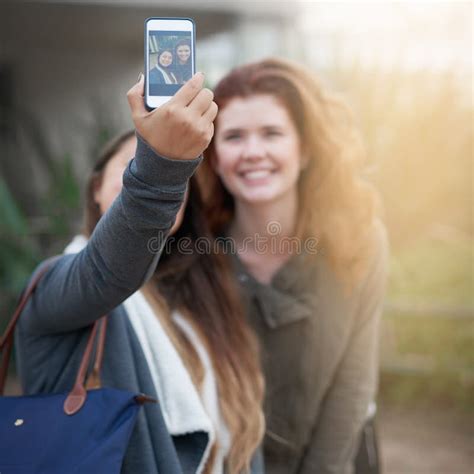 But First Let Me Take A Selfie Two Young Women Taking A Selfie