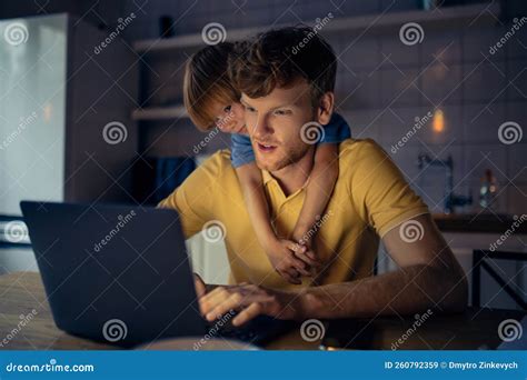 Dad And Son Watching A Movei Before Going To Bed Stock Image Image Of